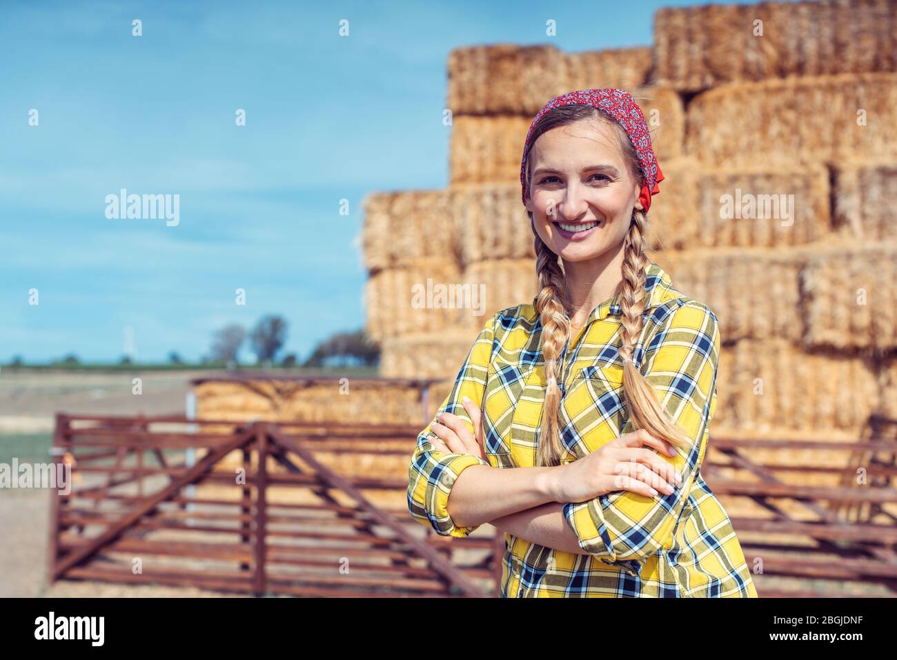 Woman standing proud on her farm Stock Photo - Alamy
