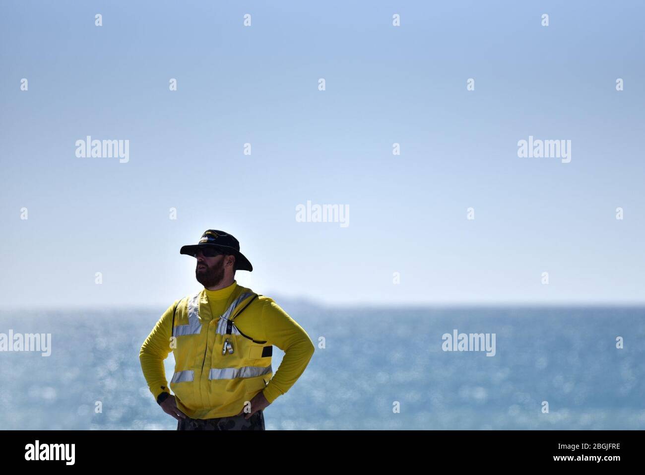 HMAS Canberra crew member watching a helicopter in 2018 Stock Photo - Alamy