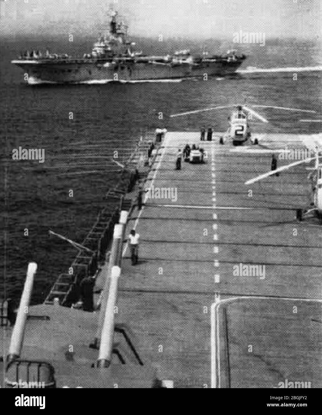 HMAS Melbourne (R21) passes aft of USS Philippine Sea (CVS-47) in May ...