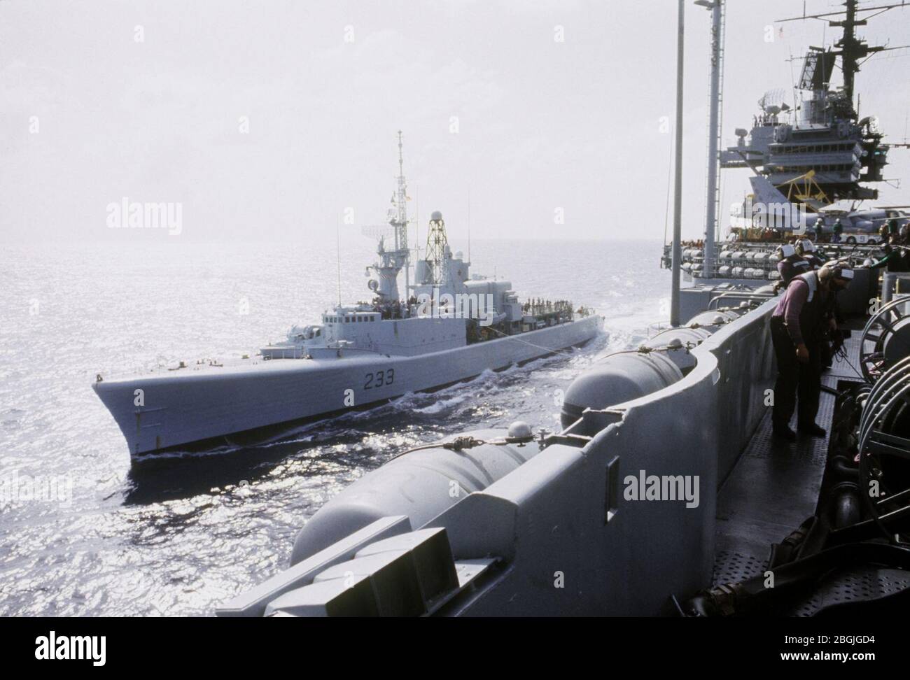 HMCS Fraser (DDH 233) sailing next to USS Saratoga (CV-60) 1985 Stock ...