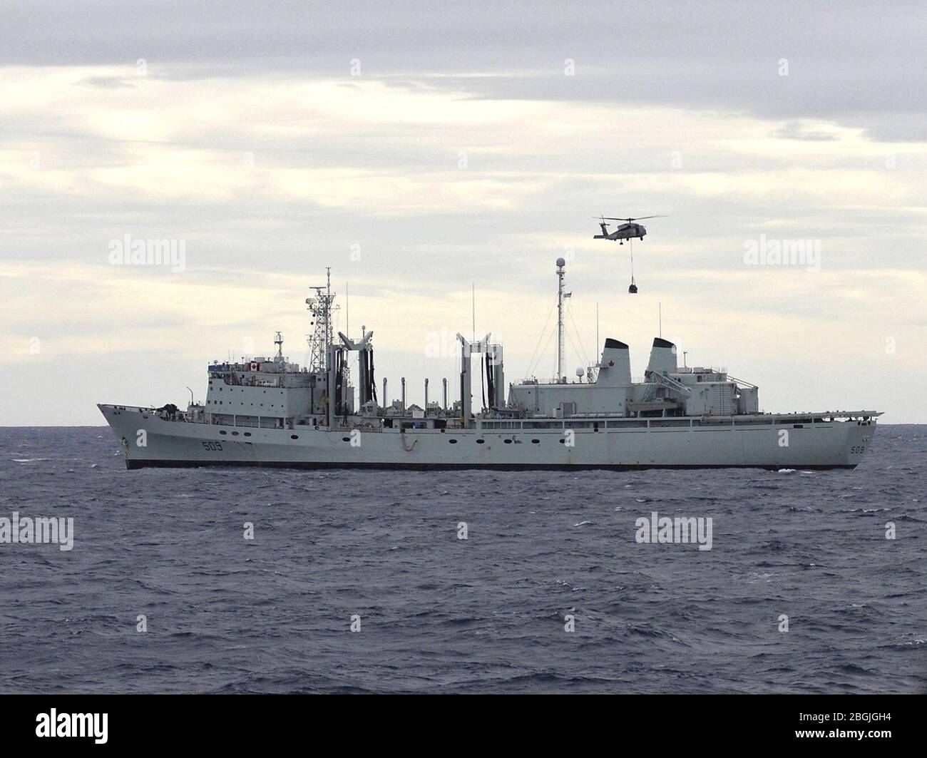 HMCS Protecteur (AOR 509) with SH-60B off Hawaii in 2014 Stock Photo ...