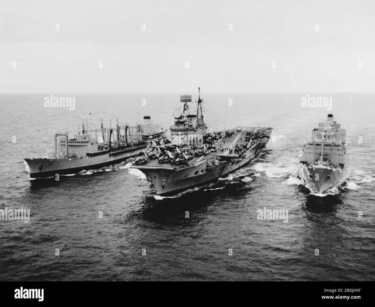 HMS Eagle (R05) is replenished by RFA Olna (A123) and RFA Resource ...