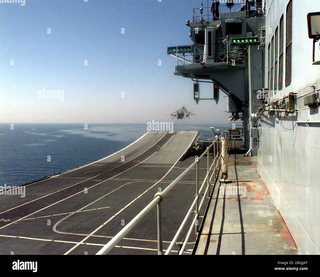 HMS Illustrious (R06) flight deck with Harrier GR7 taking off 1998 ...