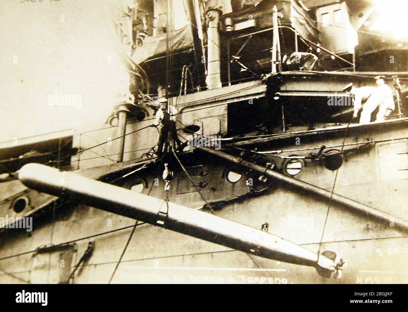 HMS Monarch, Orion-class battleship, hoisting in a torpedo, Royal Navy ...