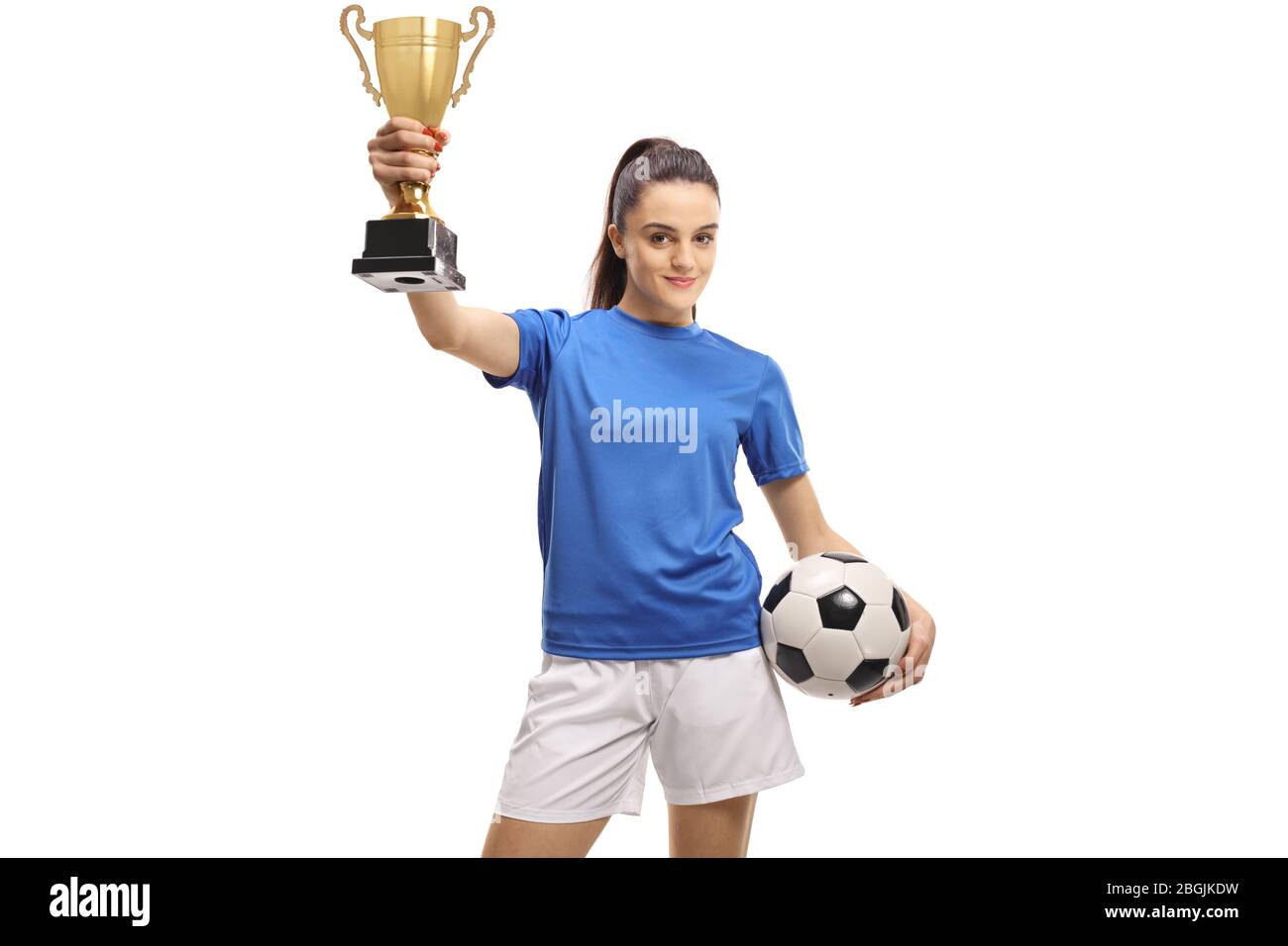 Young woman football player holding a gold trophy cup isolated on white ...
