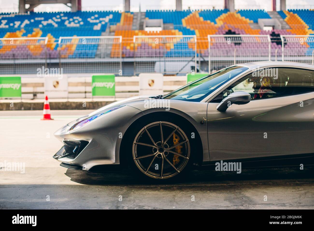 Silver racing car getting ready for a autoshow Stock Photo - Alamy