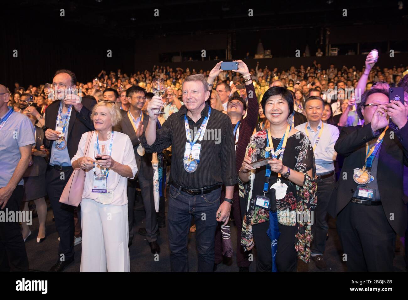 Convention goers toast during a reception at an event in Shanghai Stock ...