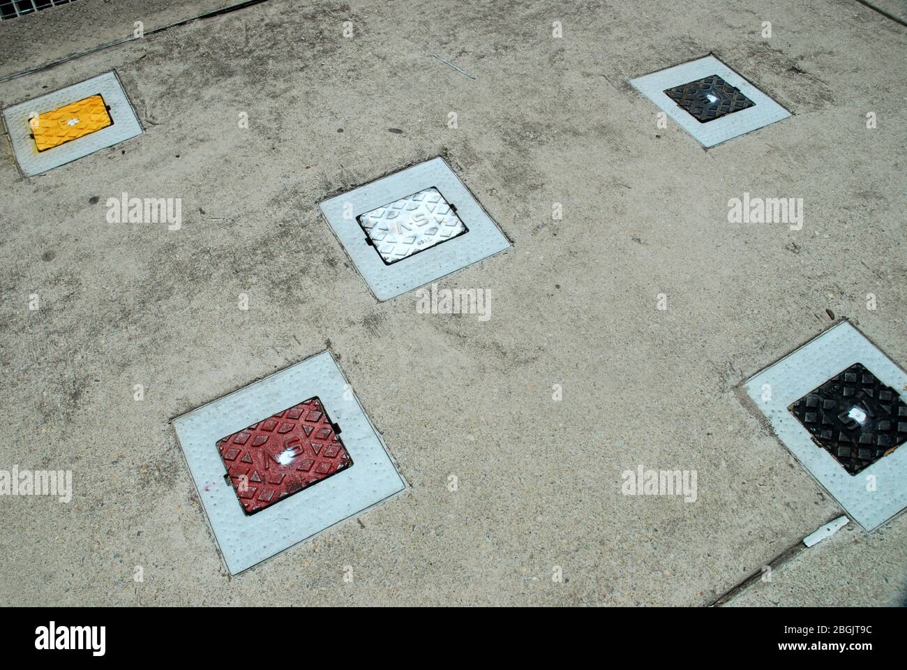 Colourful drain covers, Brisbane, Queensland, Australia Stock Photo - Alamy