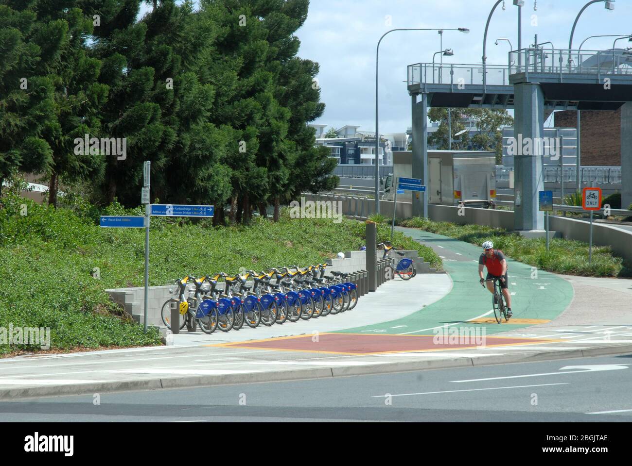 Lone cyclist on cycle path next to Go Between Toll Bridge, Brisbane ...