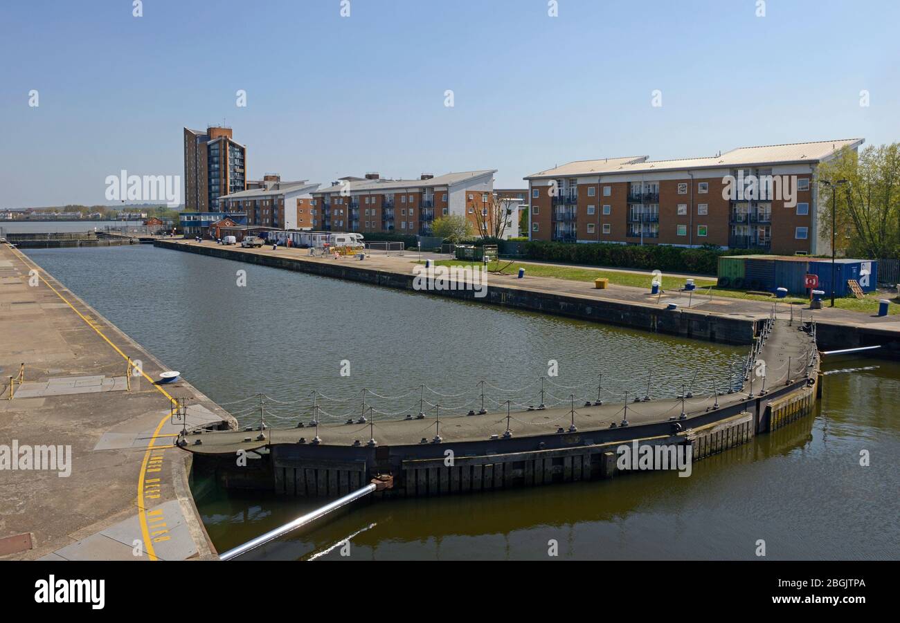 Lock entrance to the Royal Docks in eastern London, UK, with modern ...