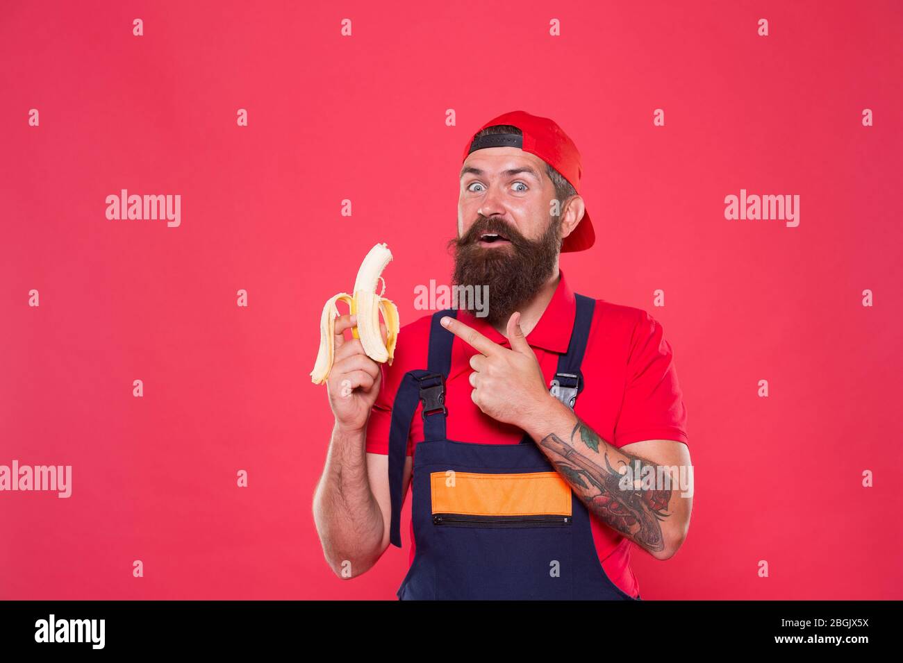 Hungry hipster. Favorite snack. Food court. Lunch time. Bearded man in ...