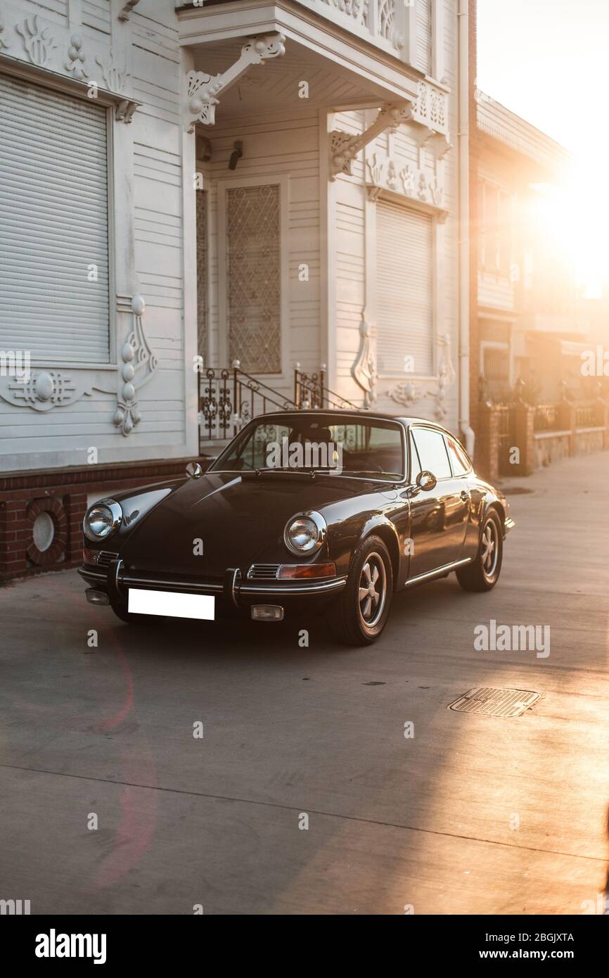 Classic retro car in the city center in front of a building Stock Photo ...