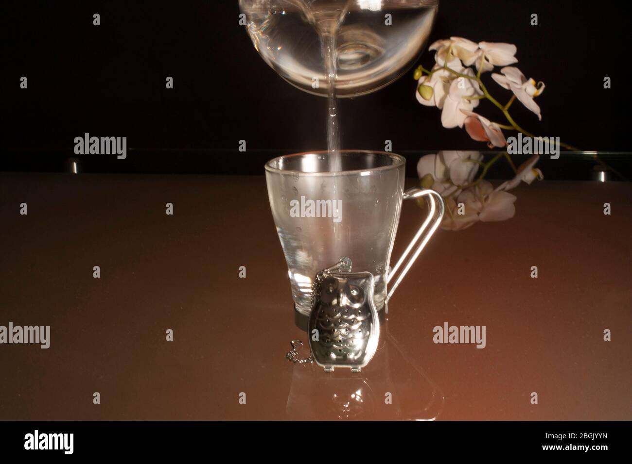 inside the transparent glass cup filled with hot water to extract the ...