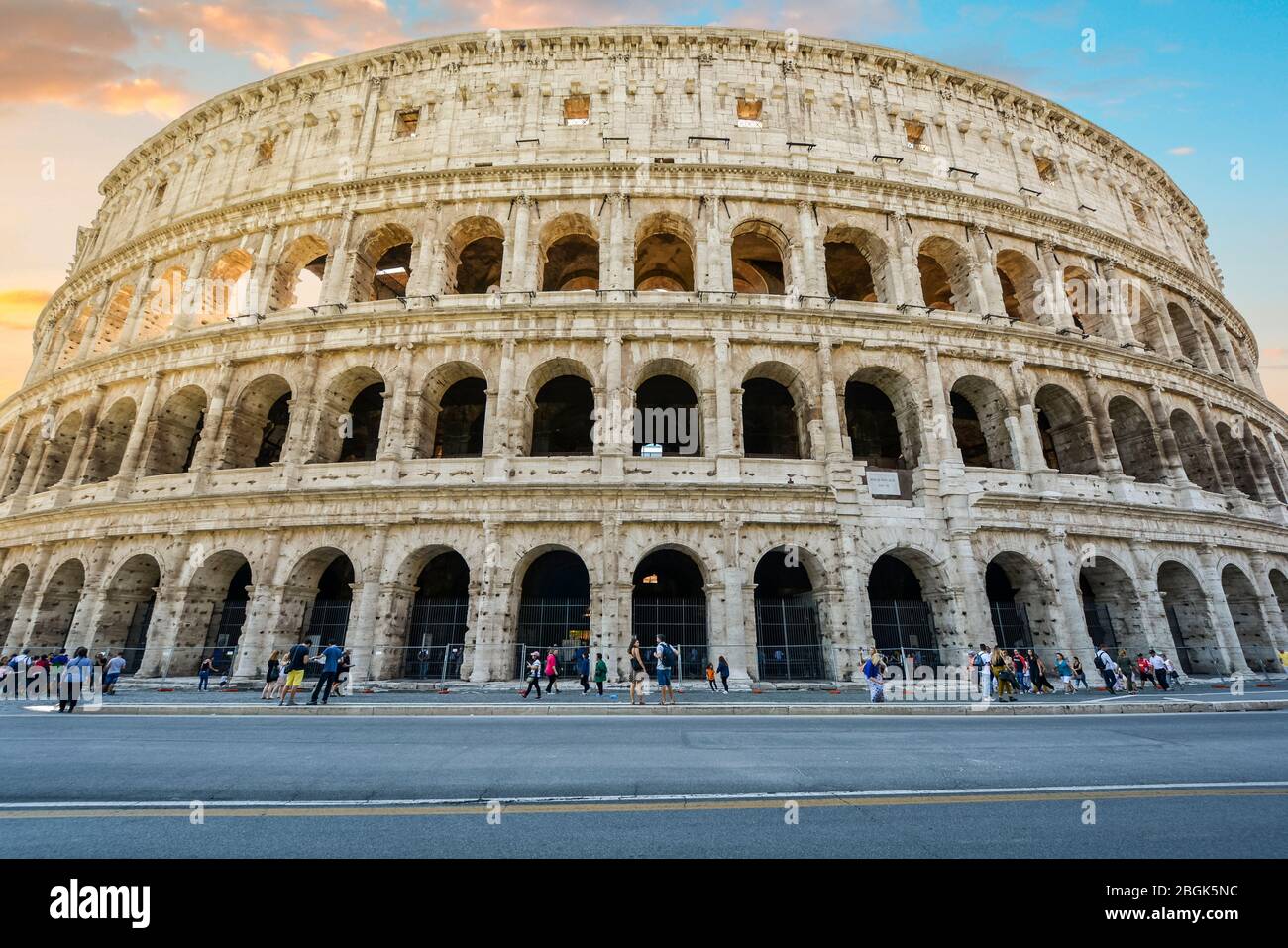 Tourists gather in front of the famous Colosseum in Rome, Italy as the ...