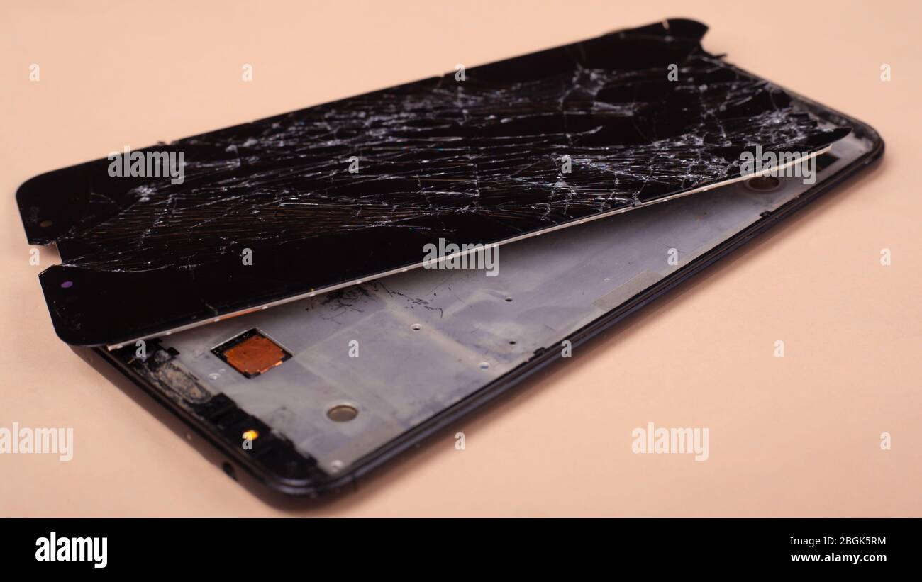 broken phone touchscreen, smartphone on a beige background Stock Photo ...