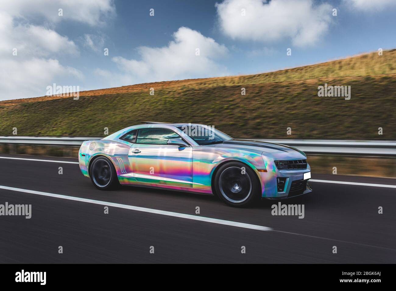 Silver sport car with colorful autotuning on the road Stock Photo - Alamy