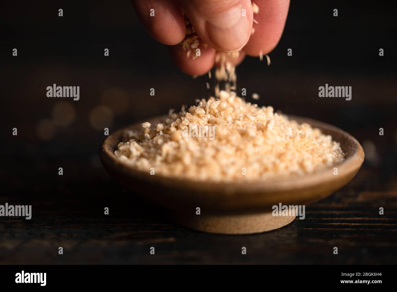 Grabbing a Pinch of Bread Crumbs Stock Photo - Alamy