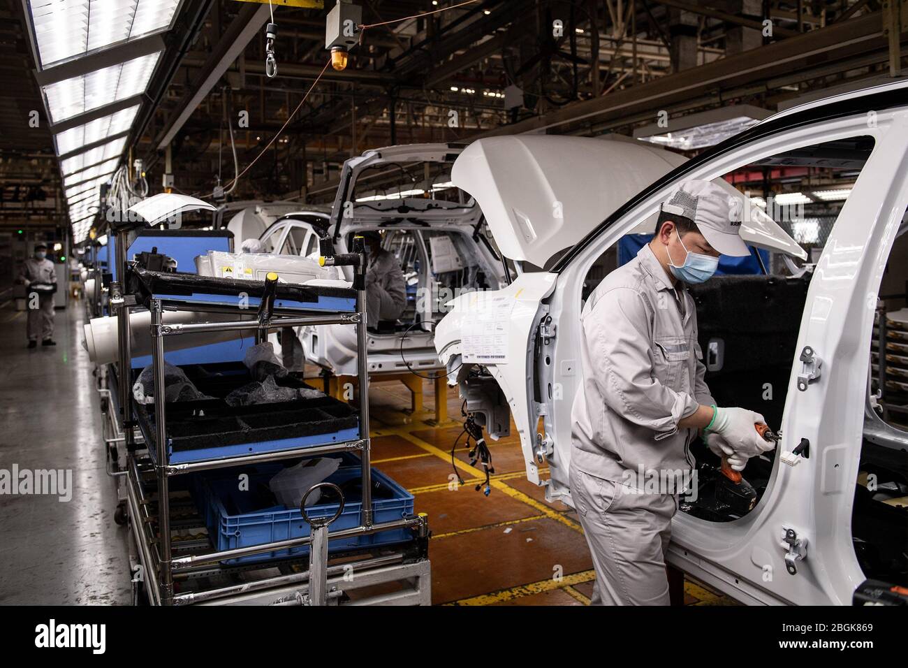 Staff of a local factory owned by Honda Motor Company, a Japanese ...