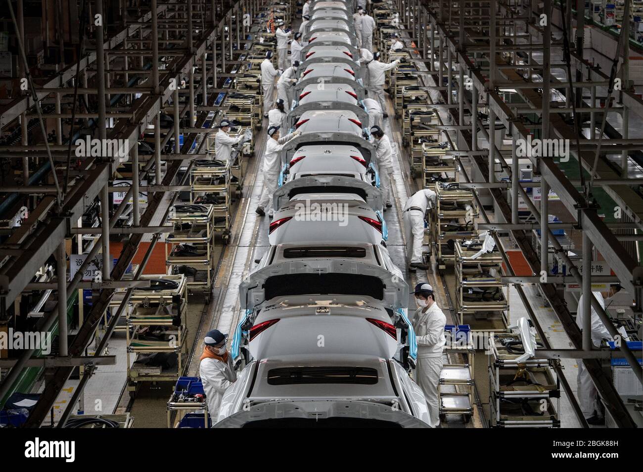 Staff of a local factory owned by Honda Motor Company, a Japanese ...