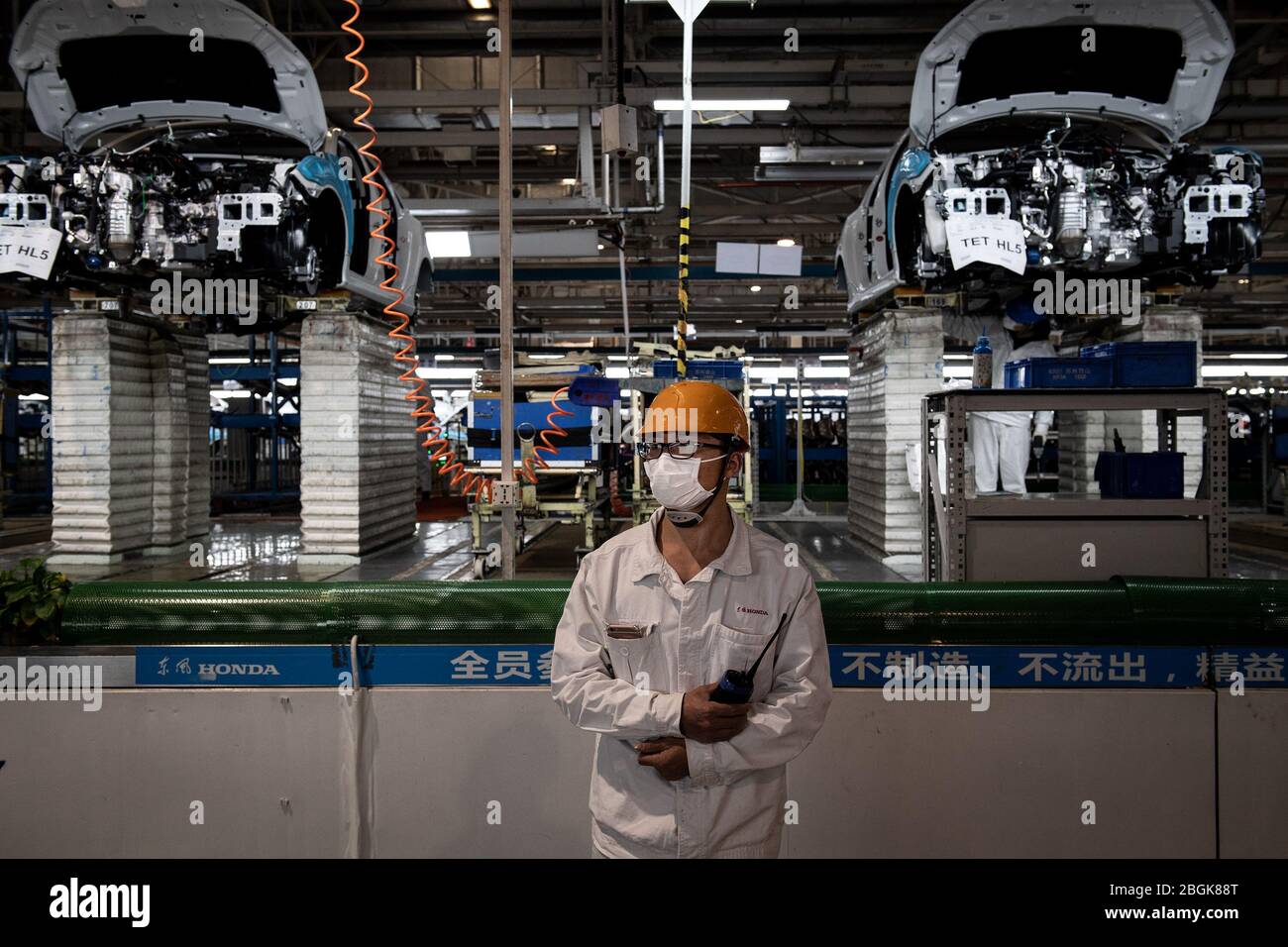 Staff of a local factory owned by Honda Motor Company, a Japanese ...