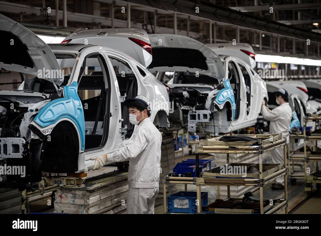 Staff of a local factory owned by Honda Motor Company, a Japanese ...
