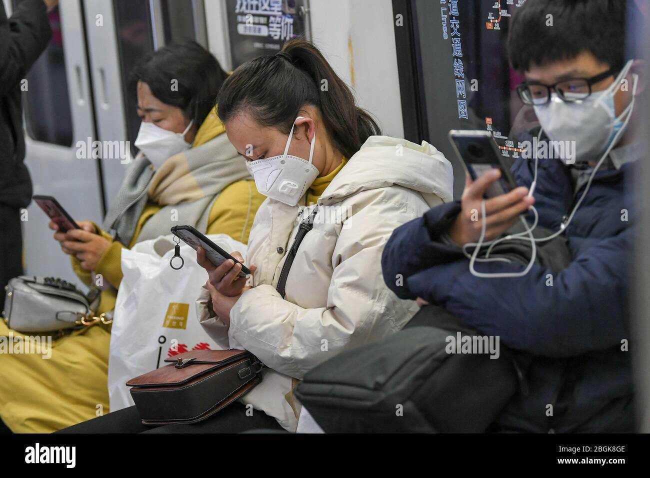 Passengers take subway to work during peak time of weekday commute ...