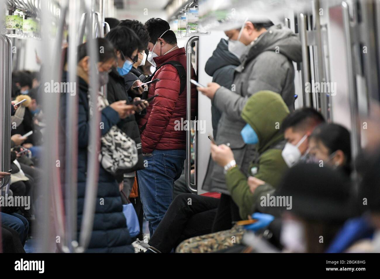 Passengers take subway to work during peak time of weekday commute ...