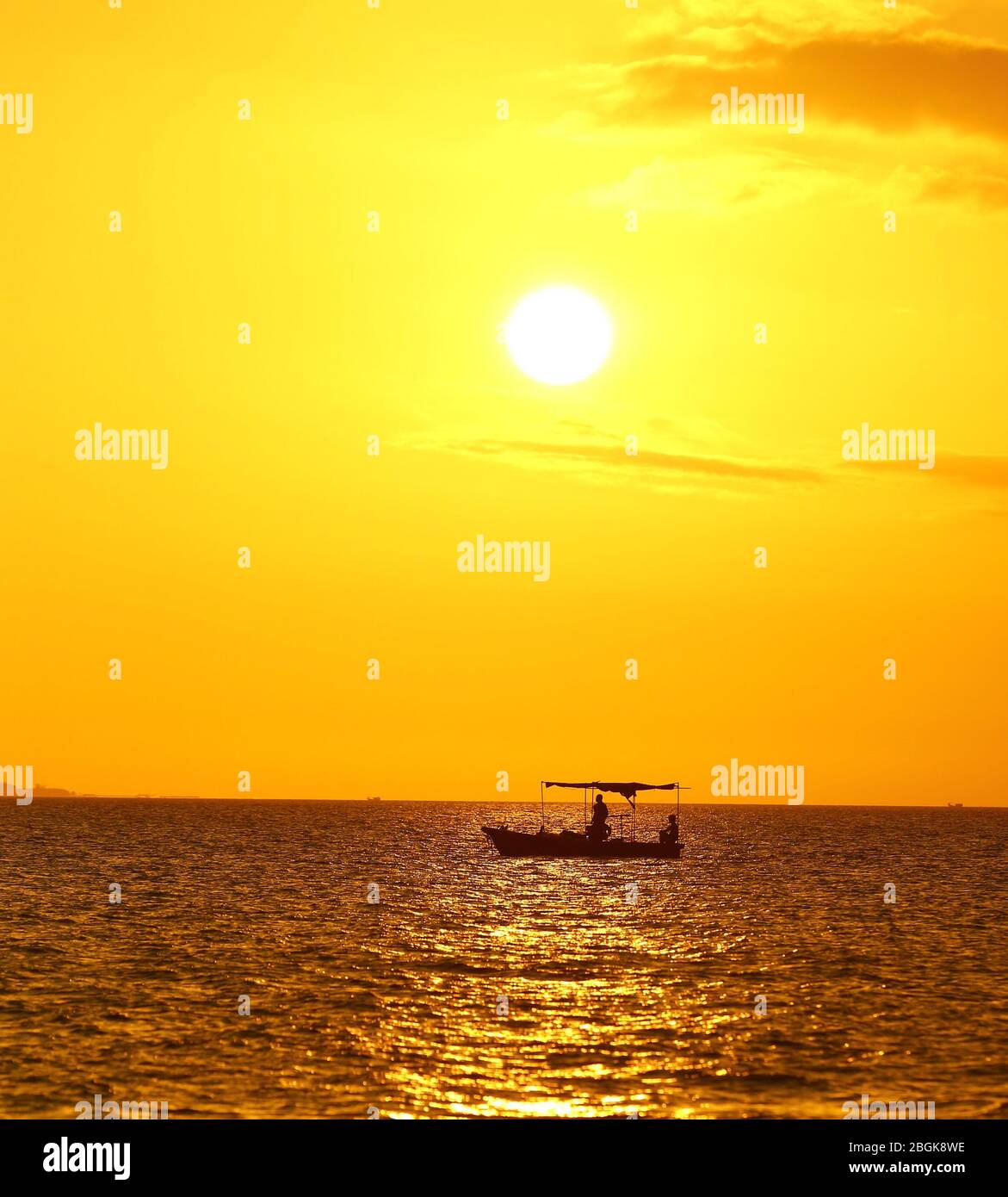 The view of seaside beach at sunset, where tourists enjoy the wonderful ...