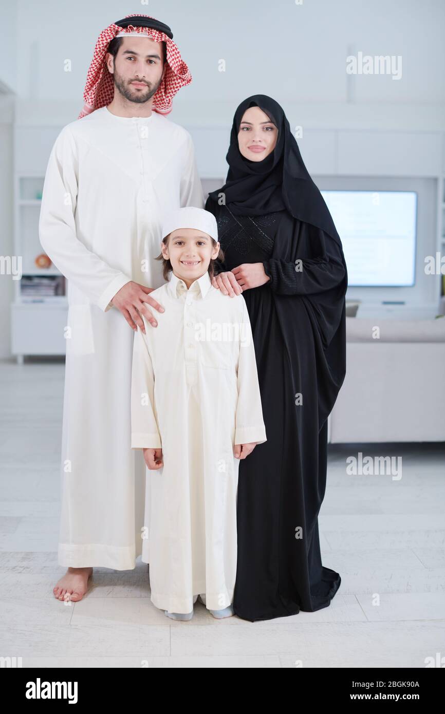 portrait of young happy arabian muslim family couple with son in ...