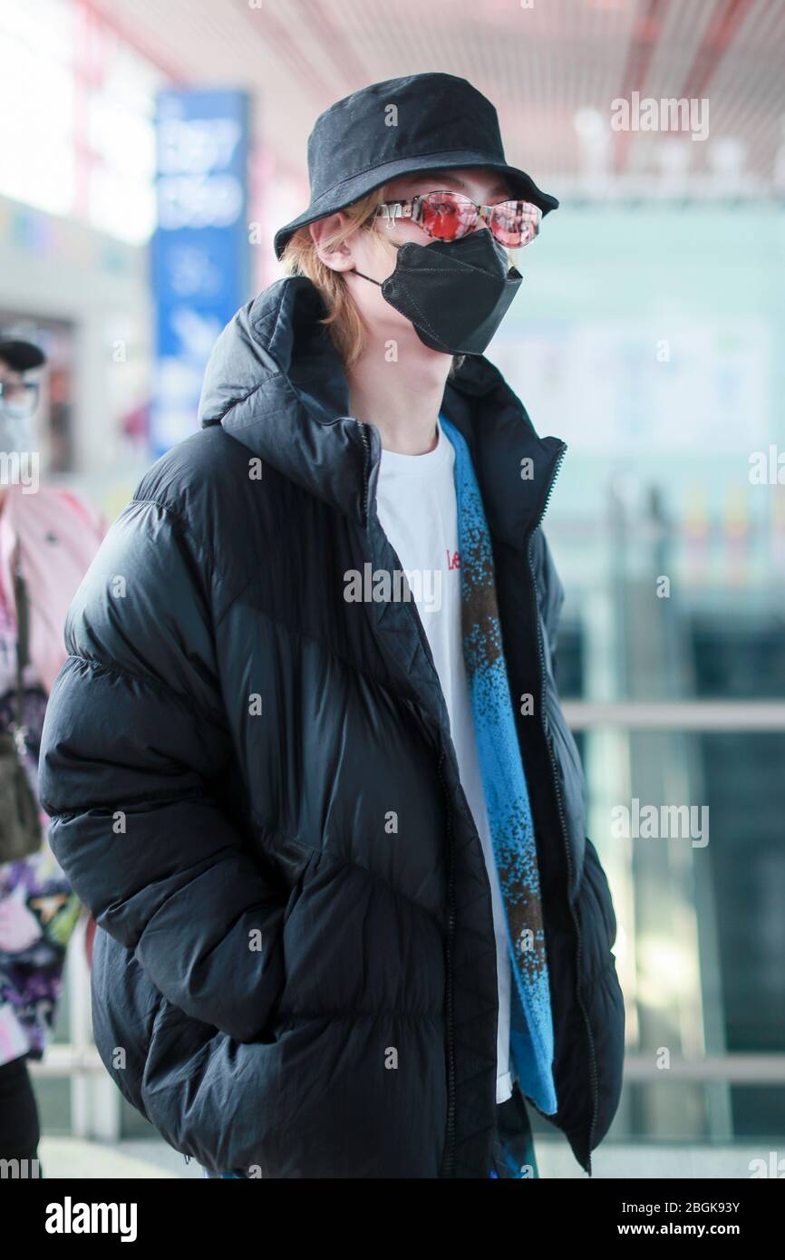 Chinese singer, dancer and rapper Huang Minghao arrives at a Beijing ...