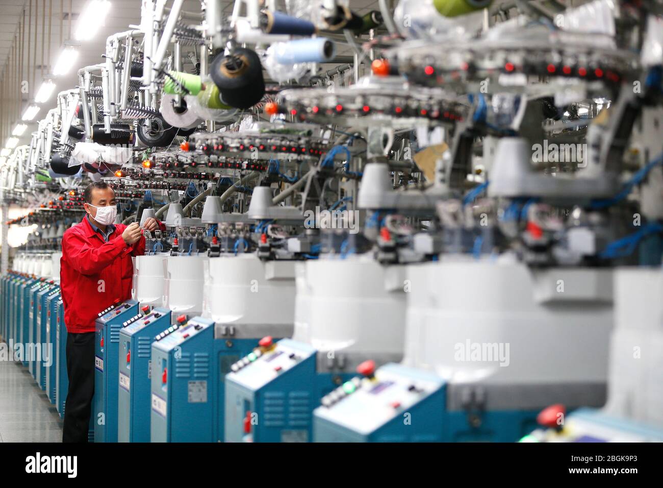 Staff at a local spinning mill work to produce to meet the demand of ...