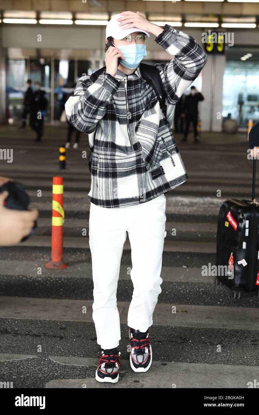 Chinese actor Liu Ruilin arrives at a Beijing airport before departure ...