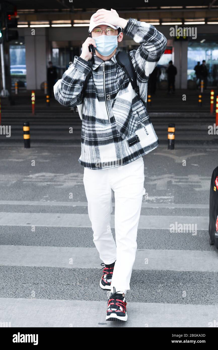 Chinese actor Liu Ruilin arrives at a Beijing airport before departure ...