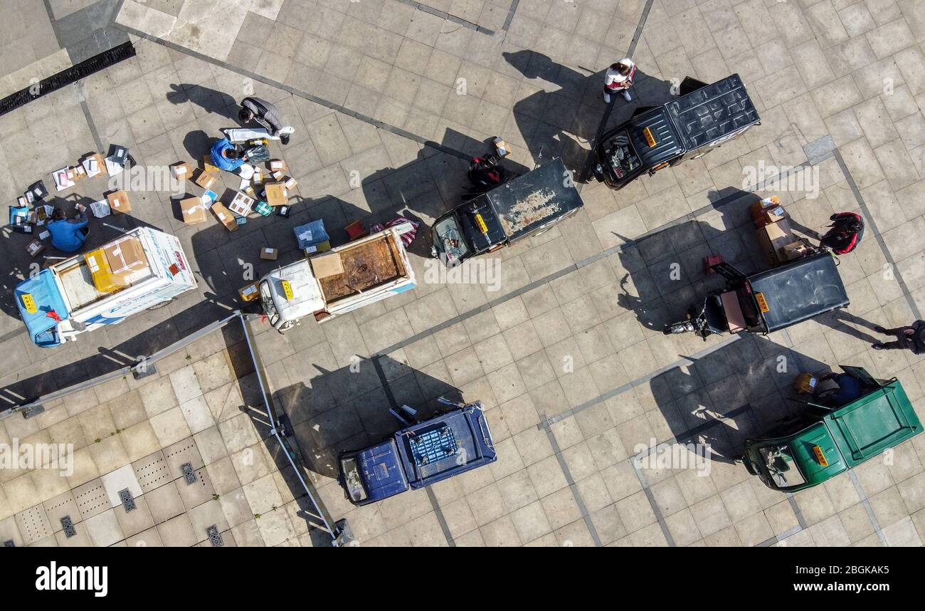 An aerial view of over 3000 parcels piling up in front of a housing ...
