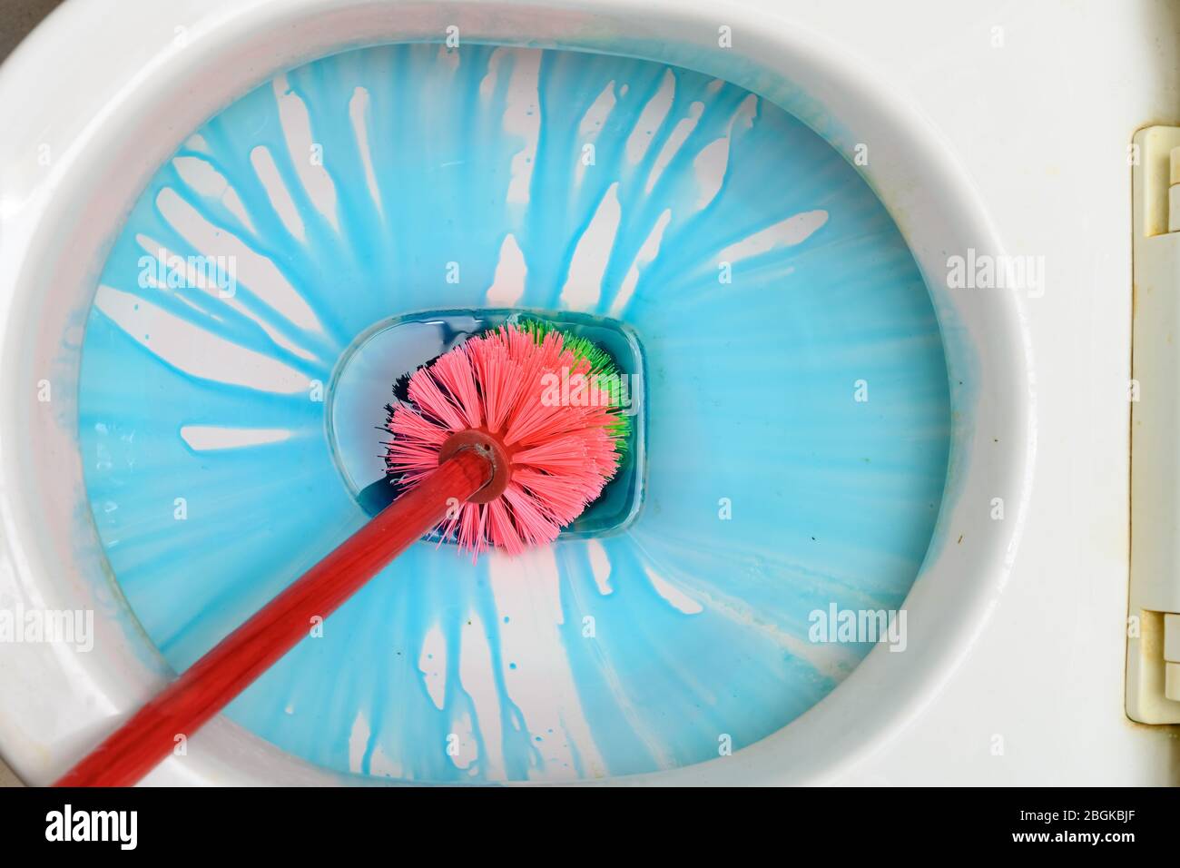 cleaning closestool with chemical liquid Stock Photo - Alamy