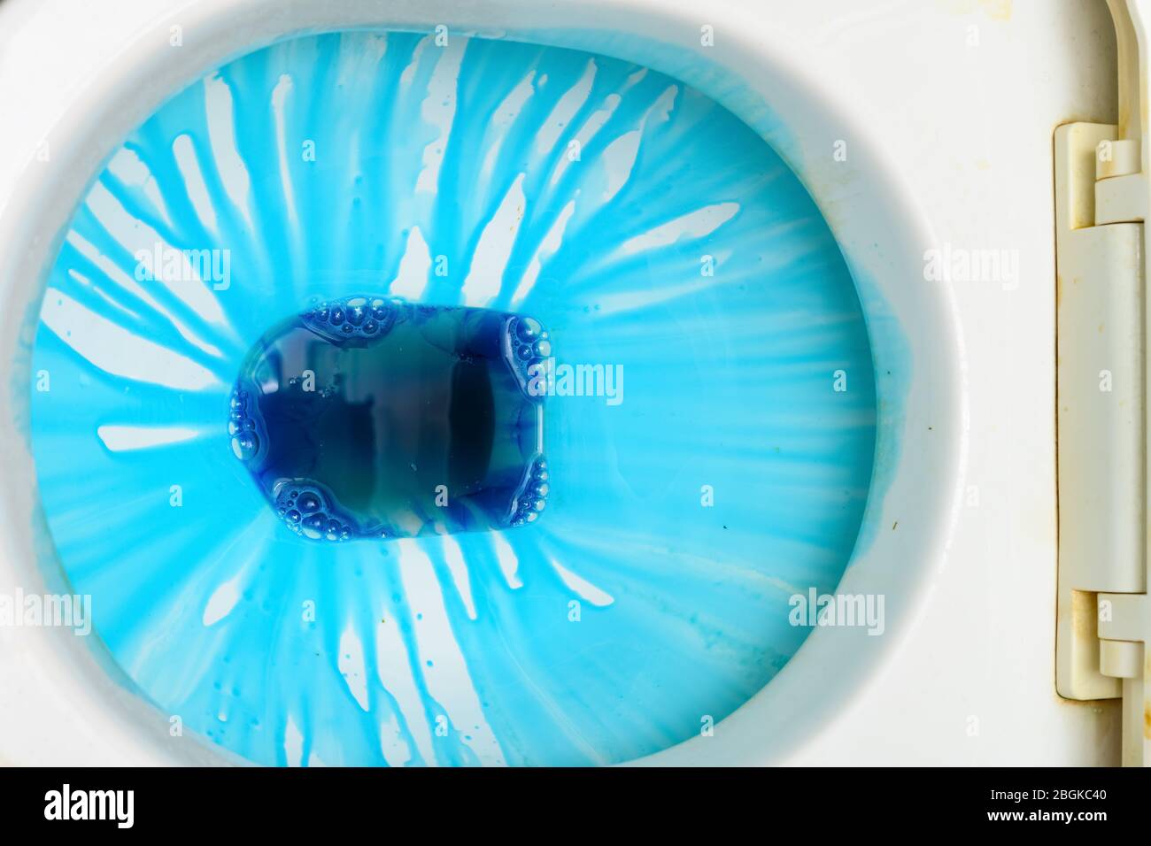 cleaning closestool with chemical liquid Stock Photo - Alamy