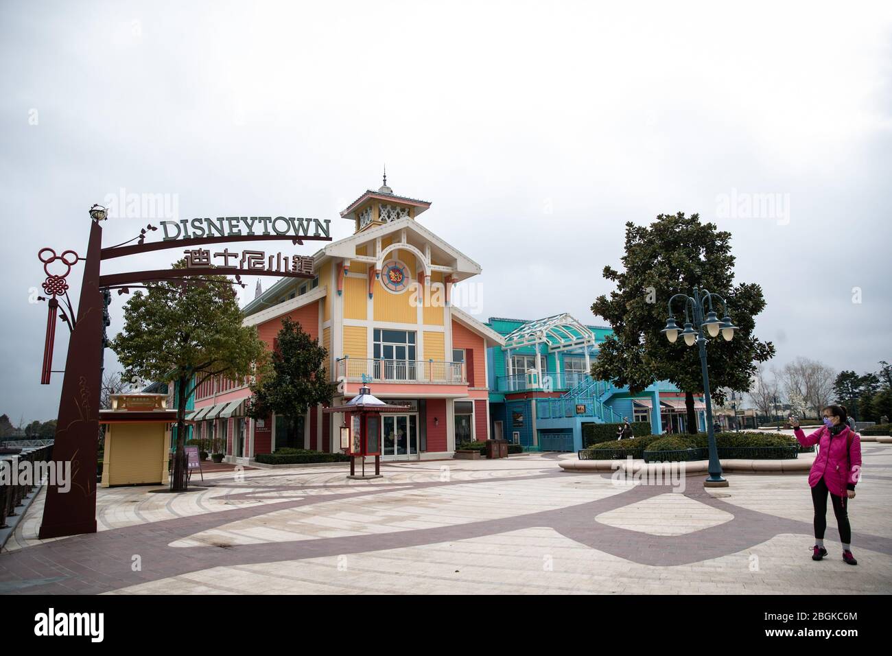 A few tourists visit Disneytown, which opens and where buildings and ...
