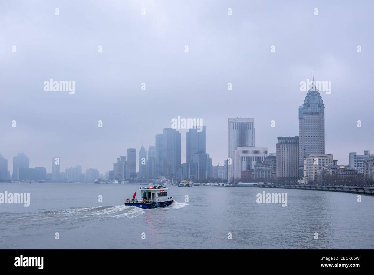 A ship moves on the Huangpu River with local landmarks including ...