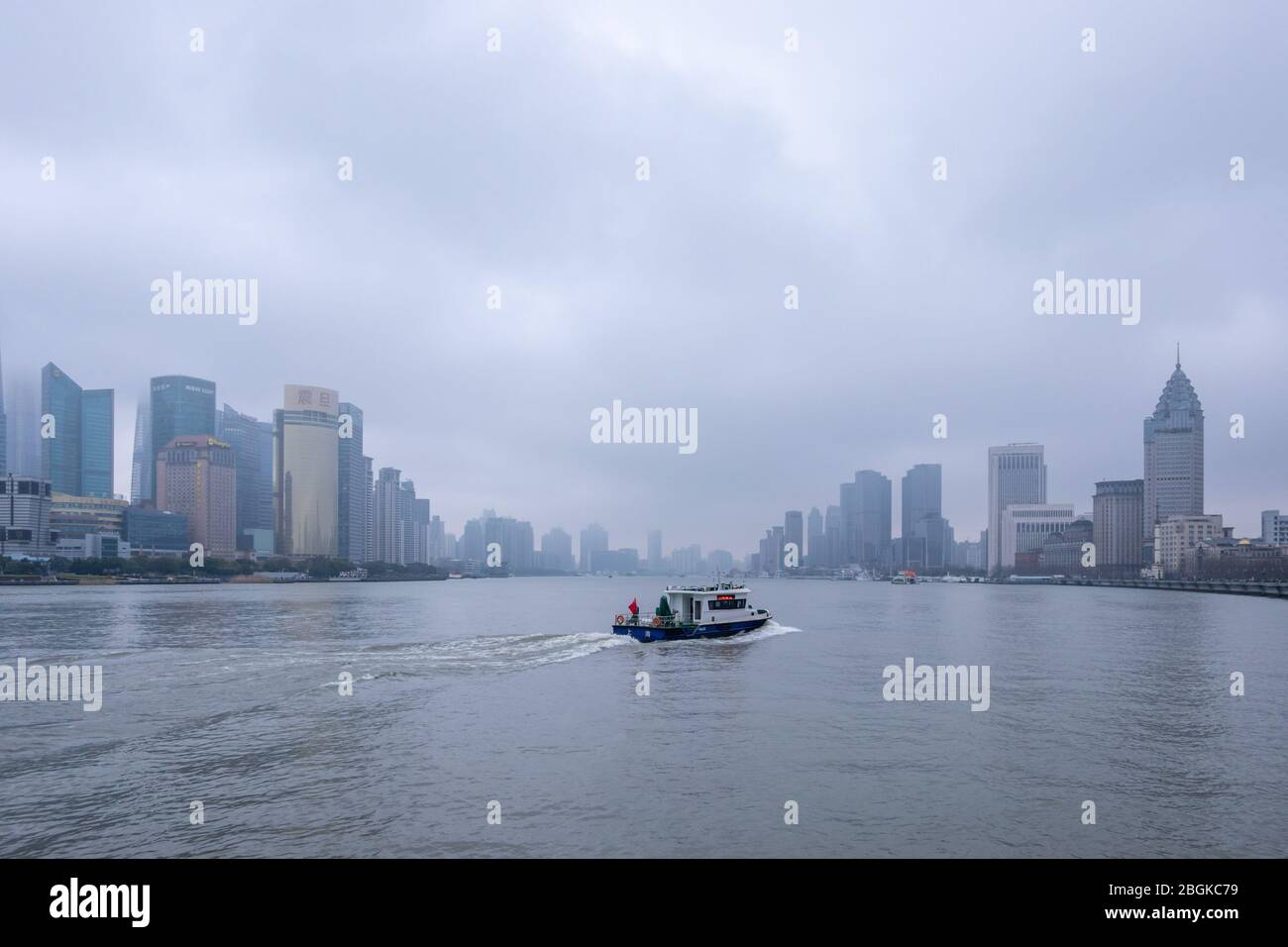 A ship moves on the Huangpu River with local landmarks including ...