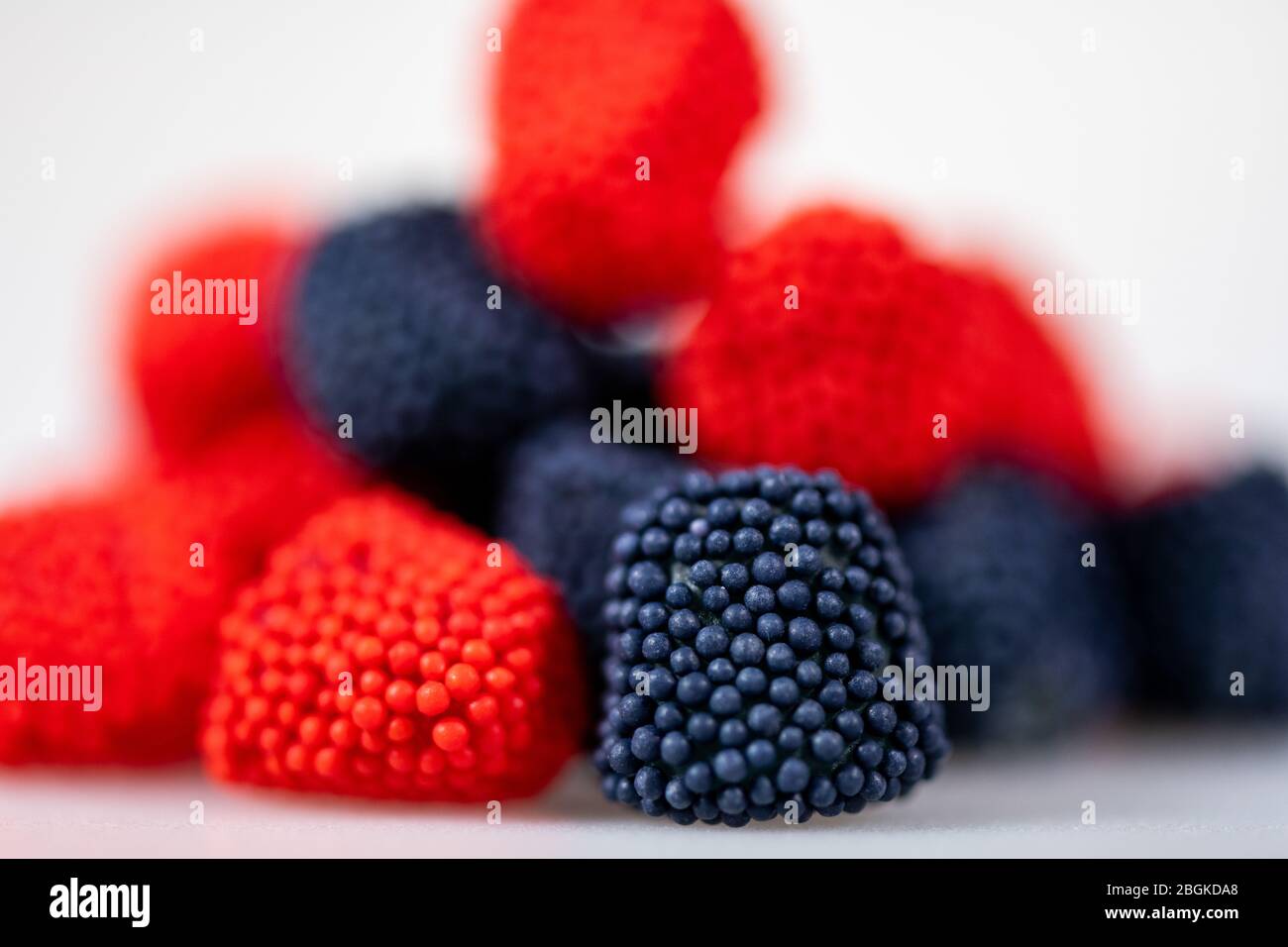 Blueberry flavored gummy candy in front of pile Stock Photo - Alamy
