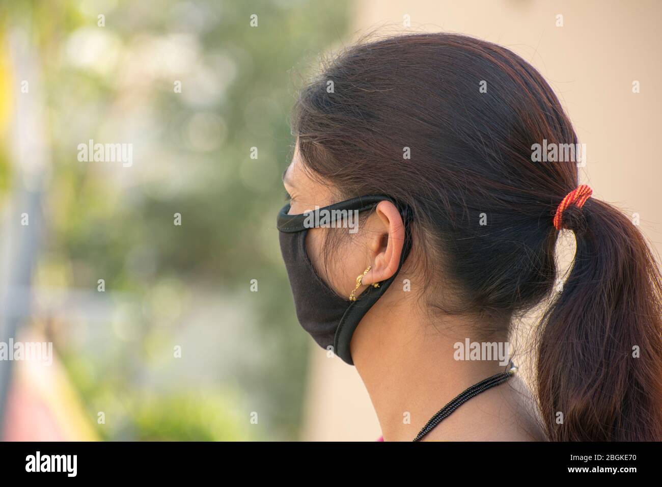 Common Indian woman in black face mast to protect from covid-19 ...