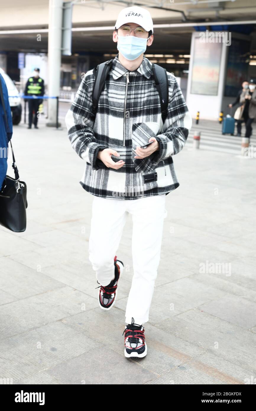Chinese actor Liu Ruilin arrives at a Beijing airport before departure ...