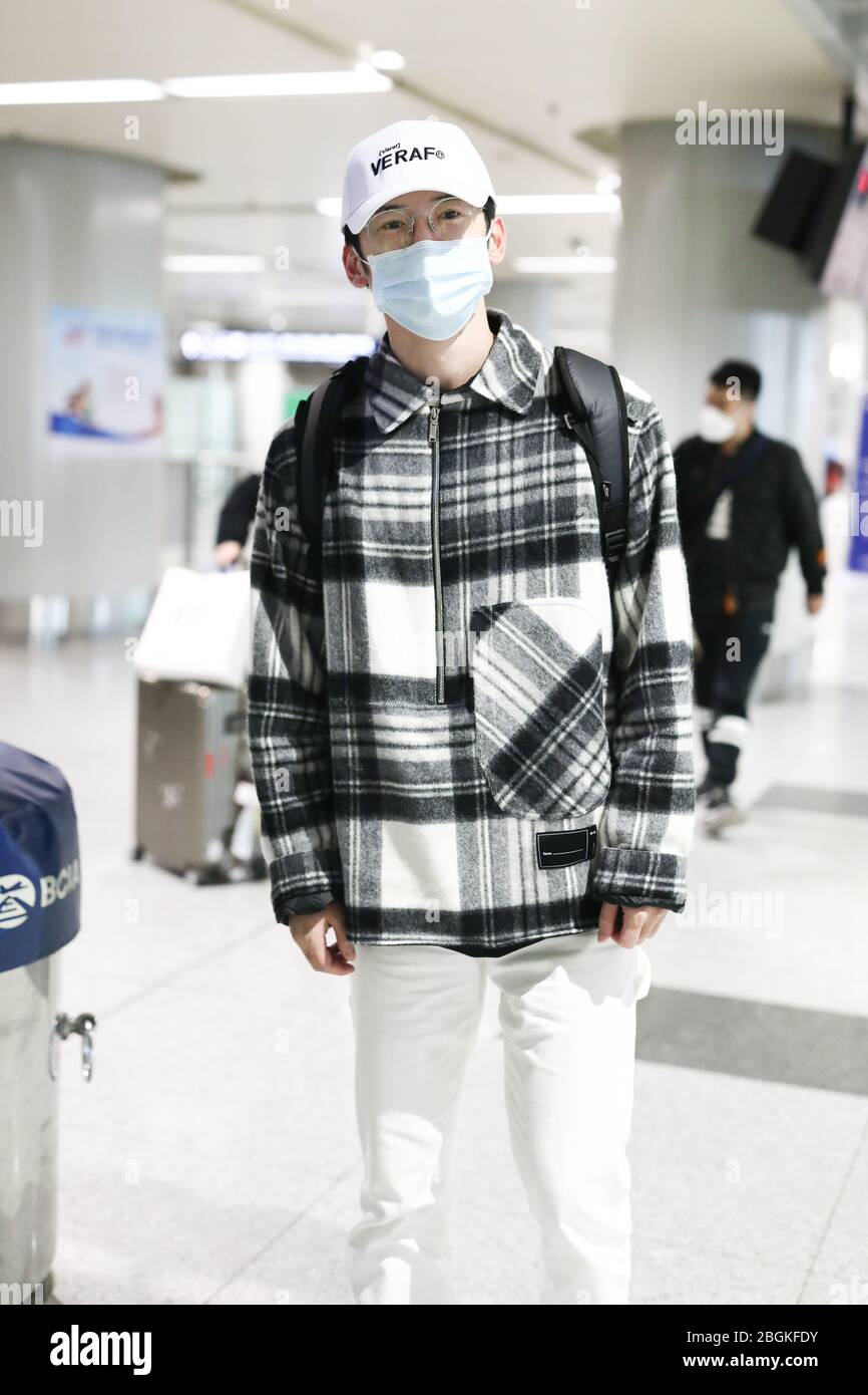Chinese actor Liu Ruilin arrives at a Beijing airport before departure ...
