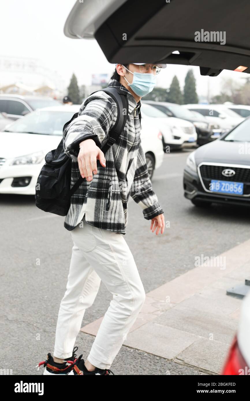 Chinese actor Liu Ruilin arrives at a Beijing airport before departure ...