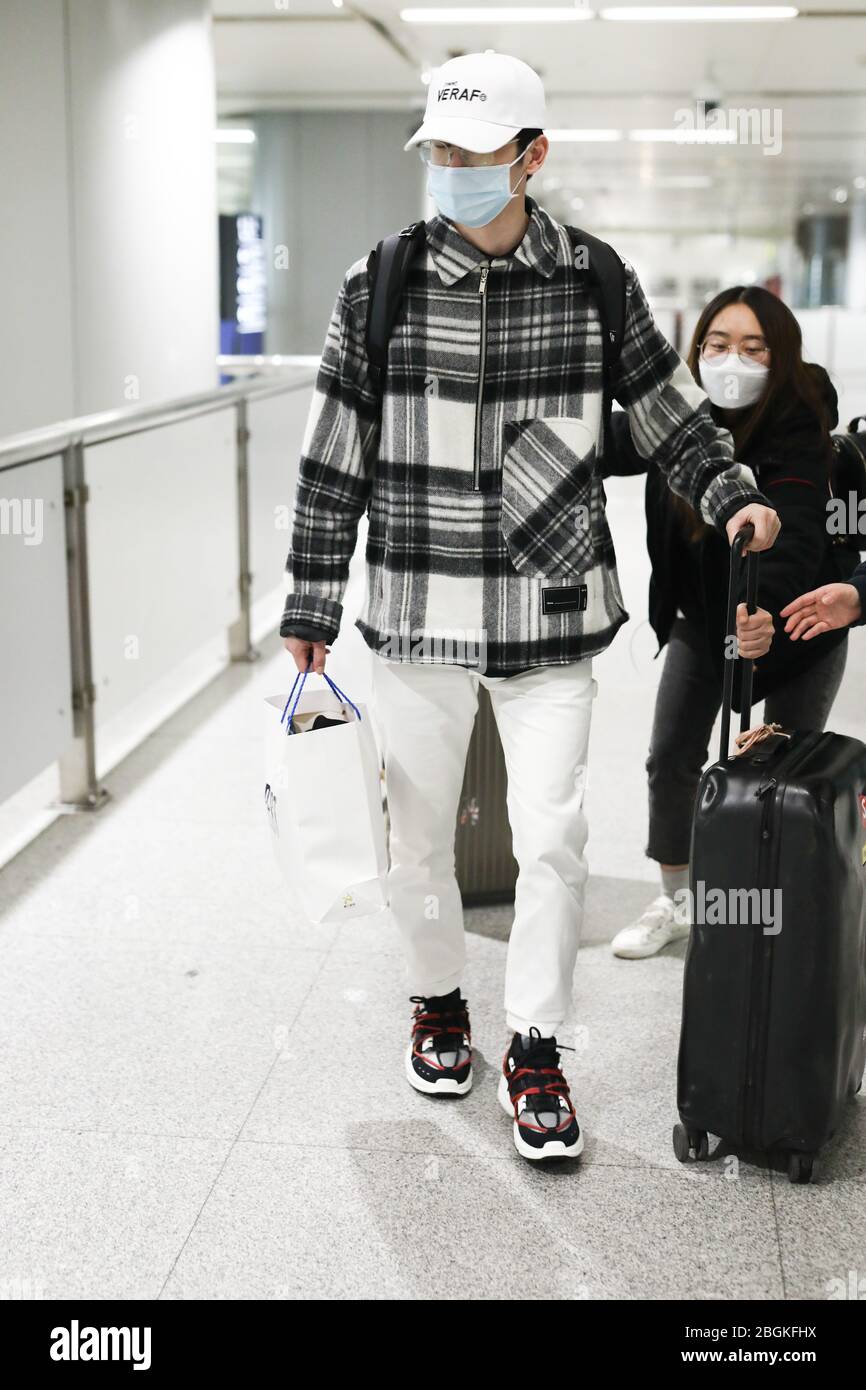 Chinese actor Liu Ruilin arrives at a Beijing airport before departure ...