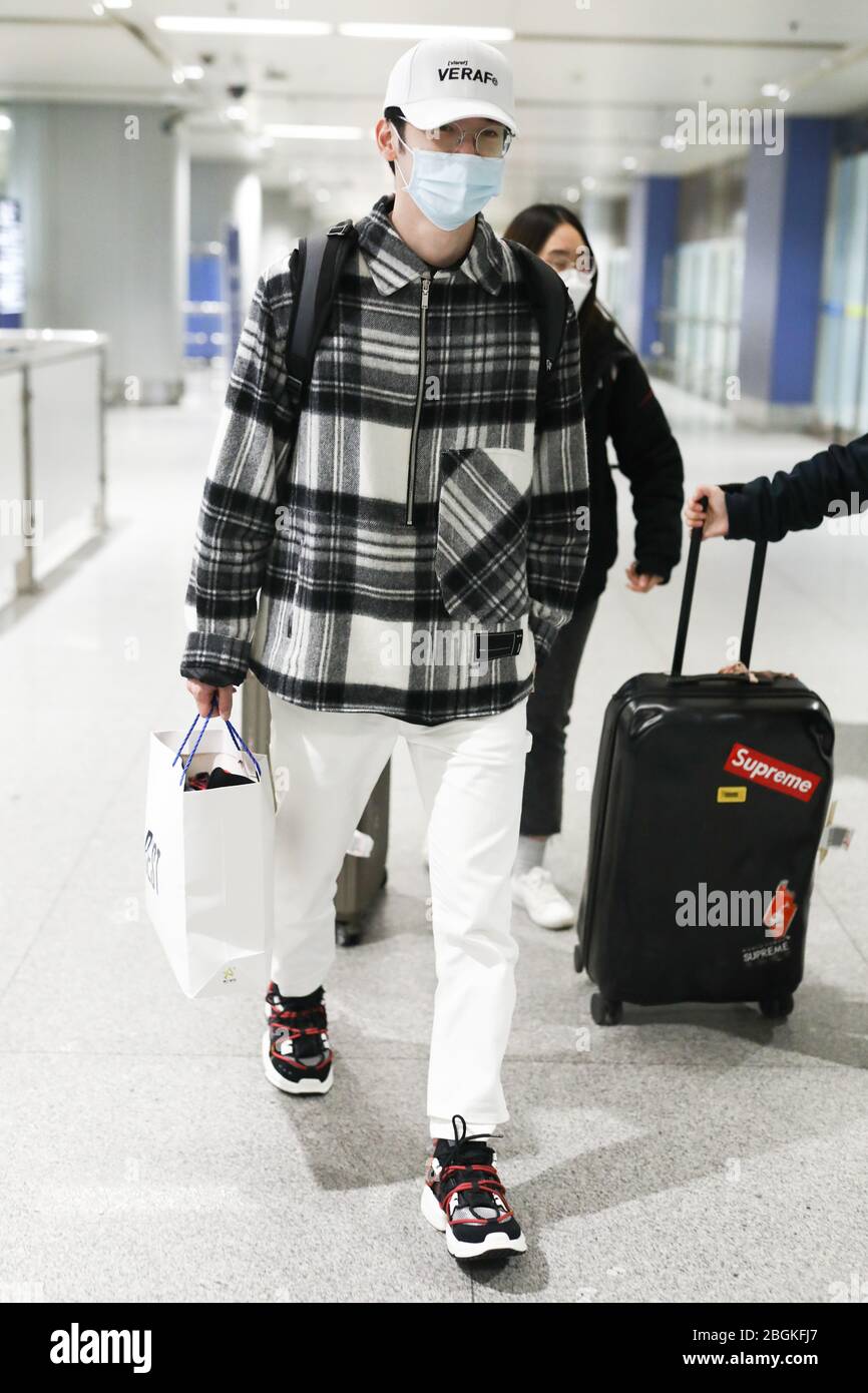 Chinese actor Liu Ruilin arrives at a Beijing airport before departure ...