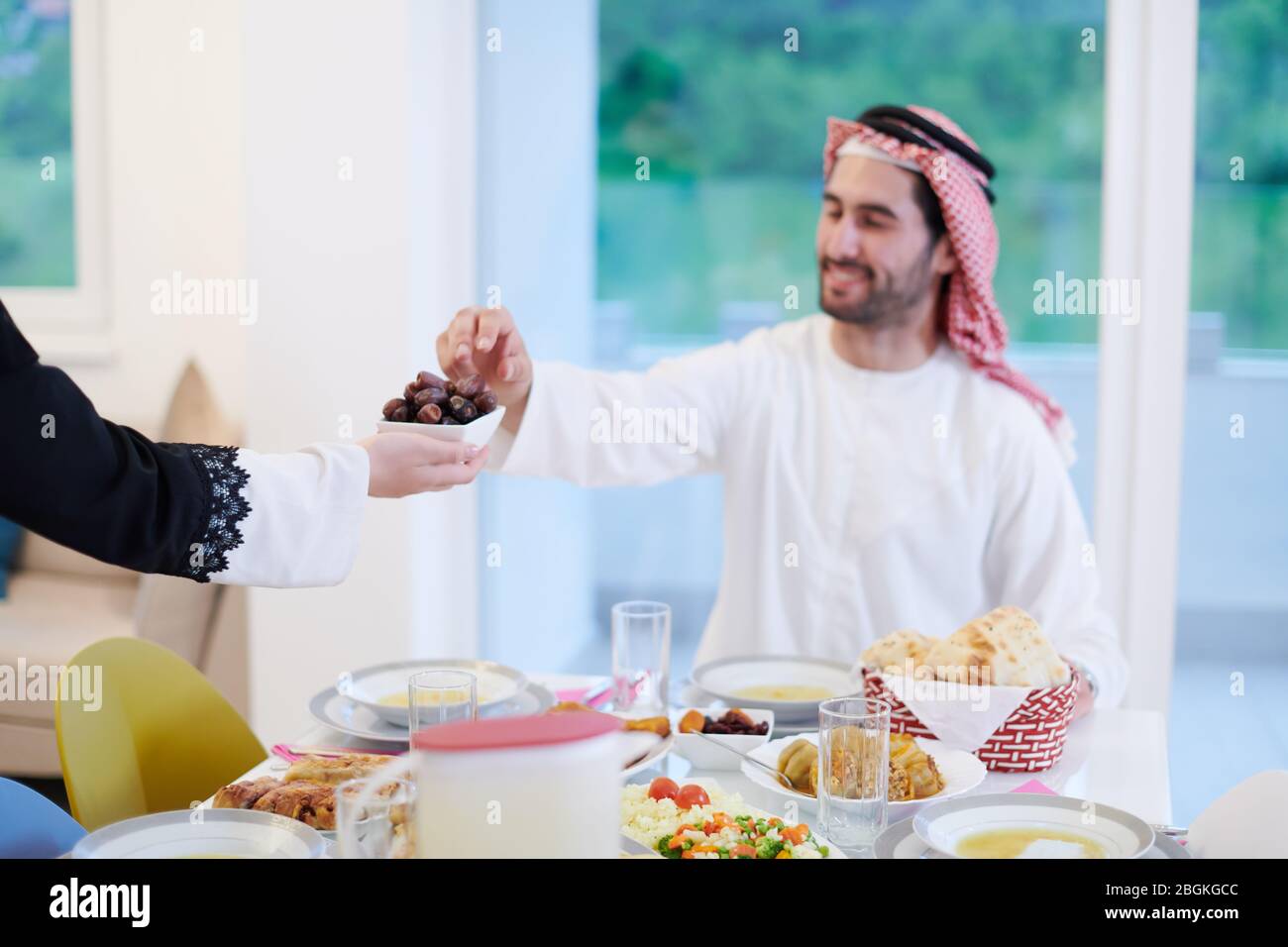 Eid Mubarak Muslim family having Iftar dinner eating dates to break ...