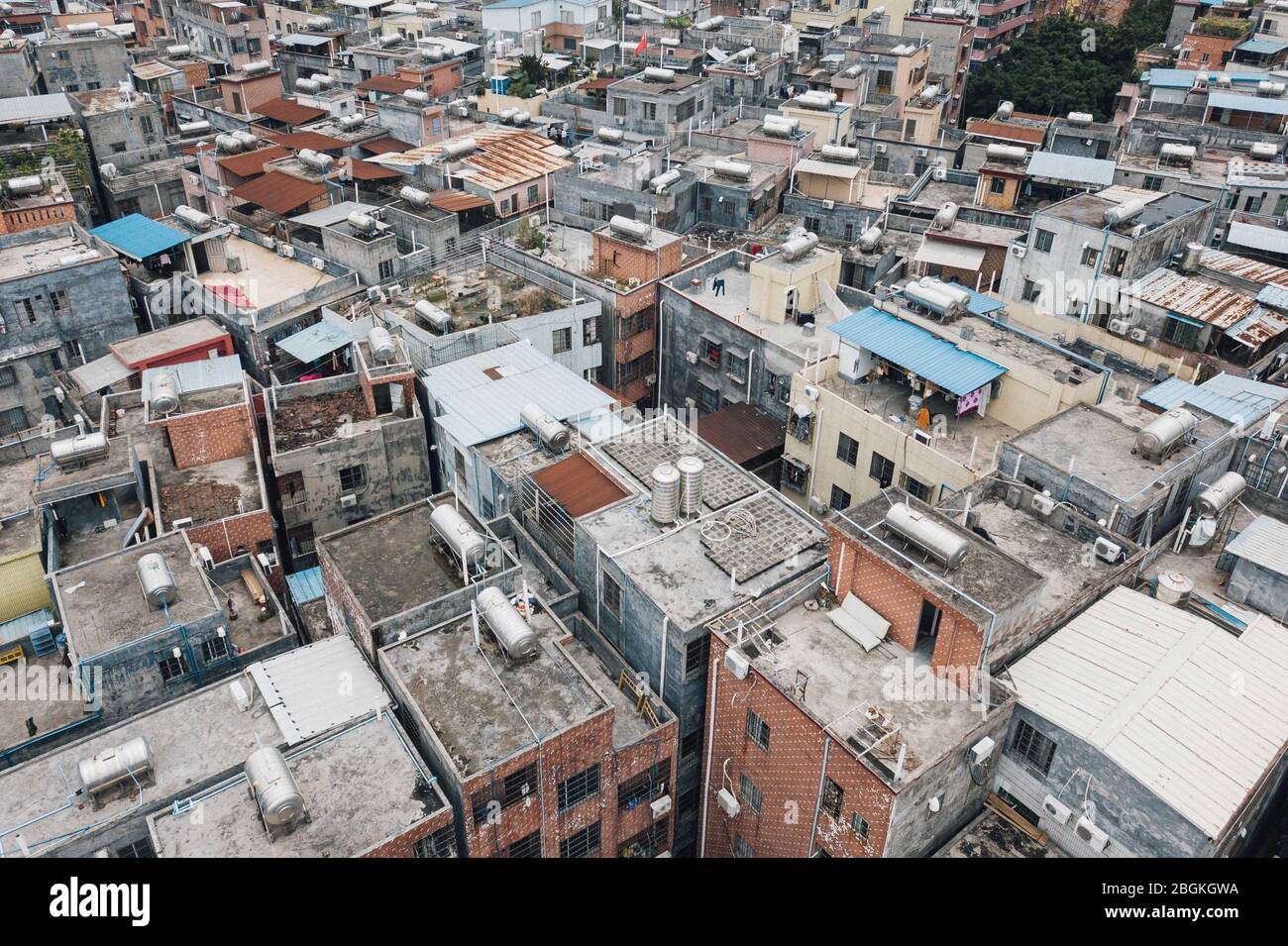 An aerial view of rows of resident buildings of various heights ...