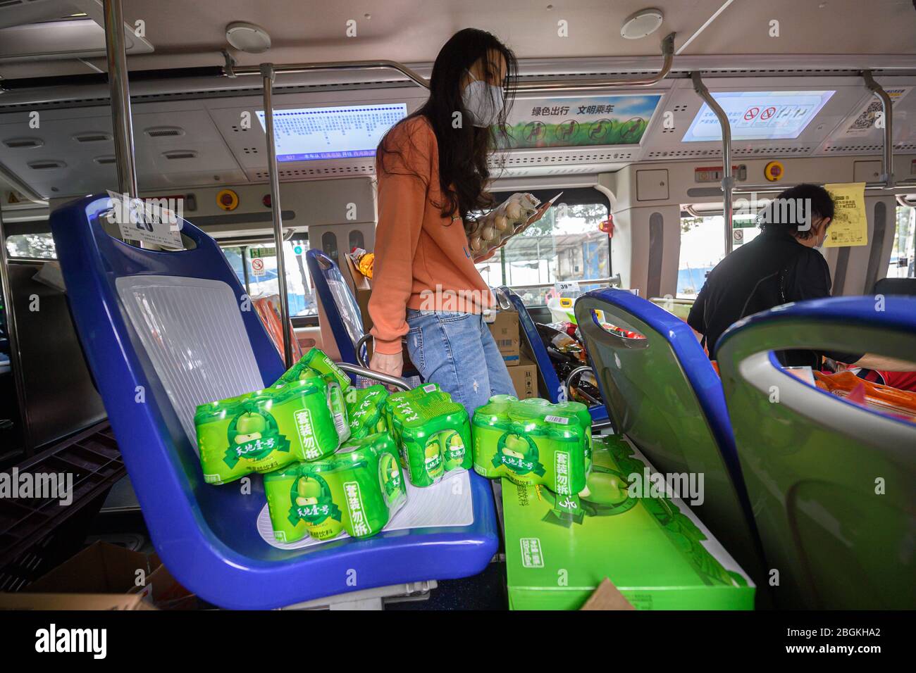 Residents purchase at the bus supermarket, which is a cooperation of ...