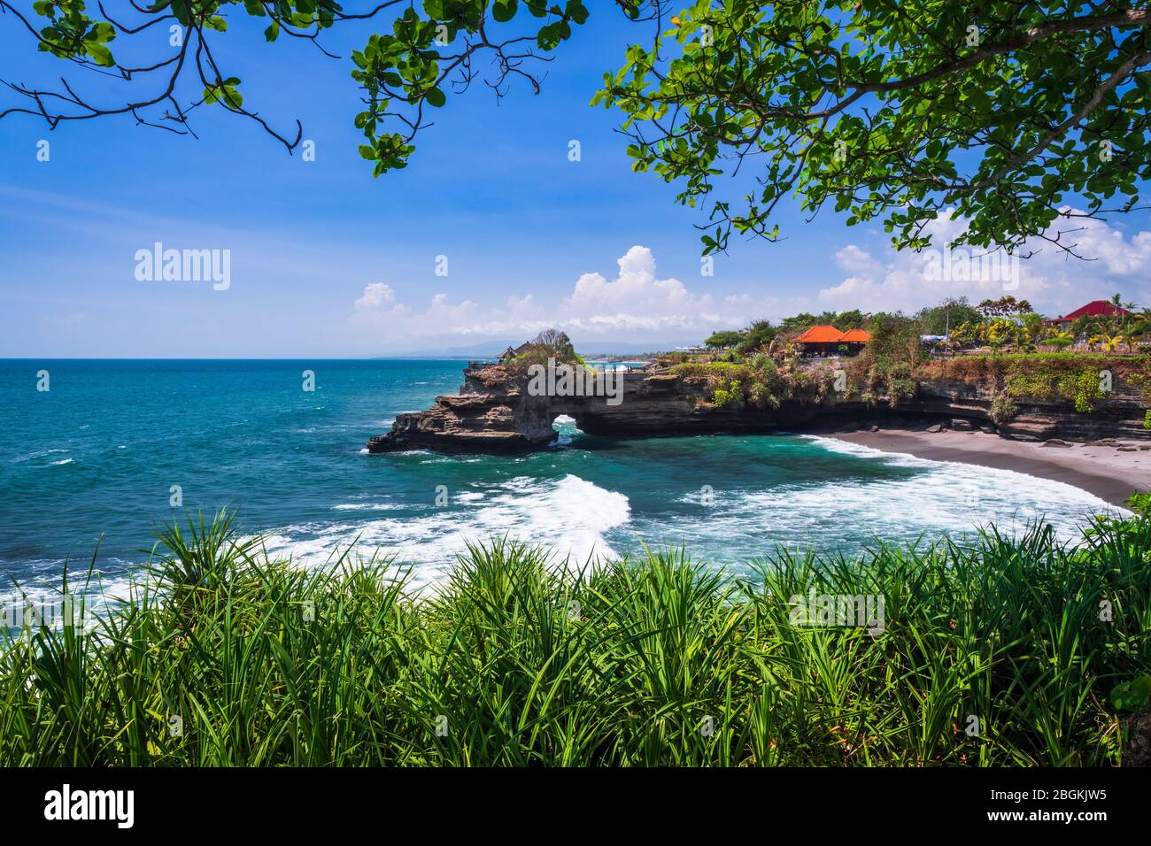 Sea arch at Tanah Lot Temple, Bali, Indonesia Stock Photo - Alamy